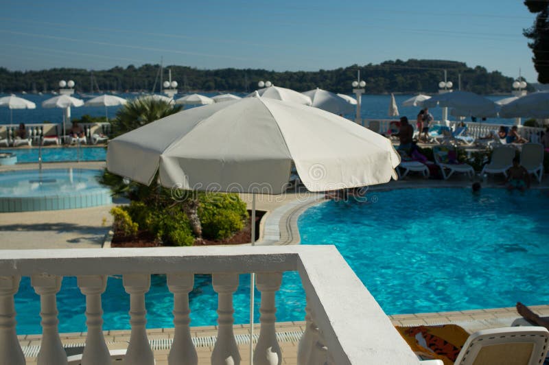 Swimming pool by the sea stock image. Image of resort - 36552025