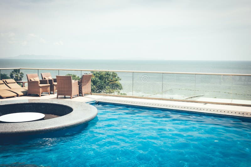 Swimming pool with seaview stock photo. Image of feet - 143100618