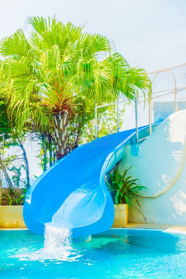 Swimming pool with slider stock photo. Image of resort - 66229592