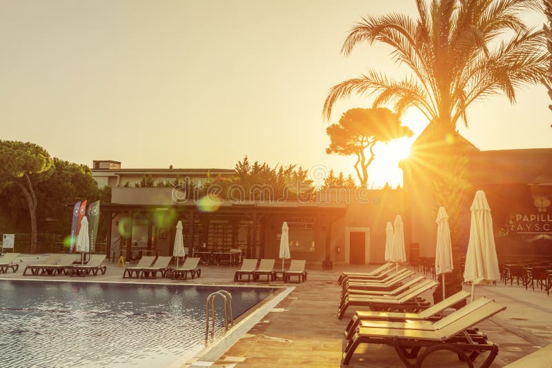Swimming Pool and Sun Beds in the Luxury Hotel in the Evening at Sunset ...