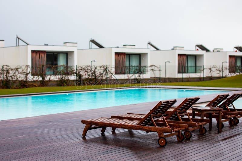 Swimming Pool with Sun Loungers in a Luxury Villa Stock Photo - Image ...