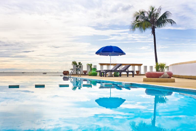 Swimming pool at sun rise. stock photo. Image of exotic - 34696858