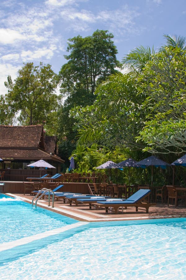 Swimming Pool on a Sunny Day. Stock Photo - Image of holiday, parasol ...