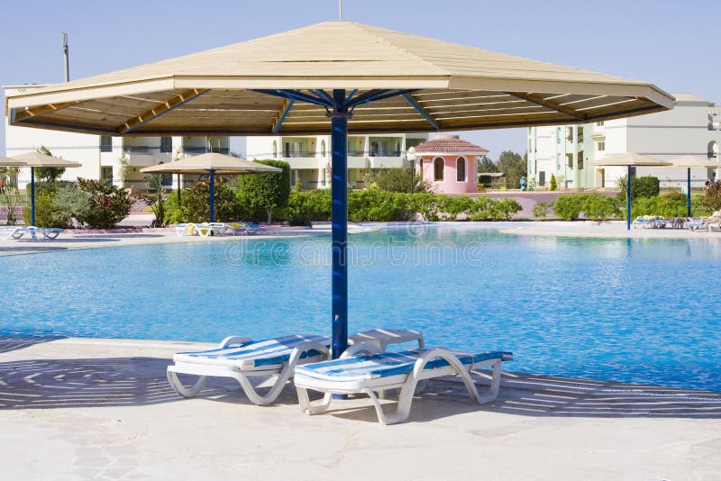 Swimming Pool on a Sunny Day. Stock Image - Image of colorful, ocean ...