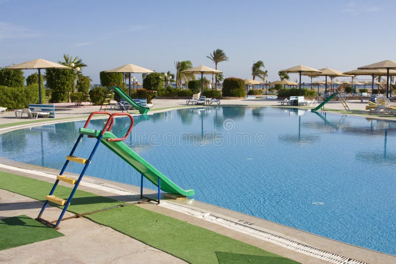 Swimming Pool on a Sunny Day. Stock Photo - Image of beach, luxurious ...