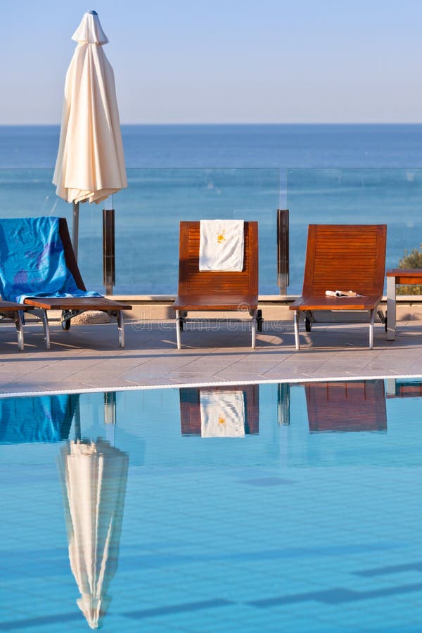 Swimming Pool on a Sunny Day Stock Image - Image of blue, hotel: 115985961