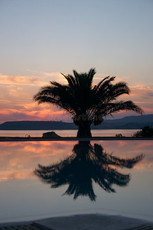 Swimming pool sunset stock photo. Image of kefallonia - 2449298