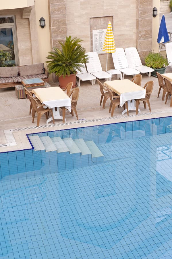 Beach Seats Near Swimming Pool with Soft Sunlight Stock Image - Image ...