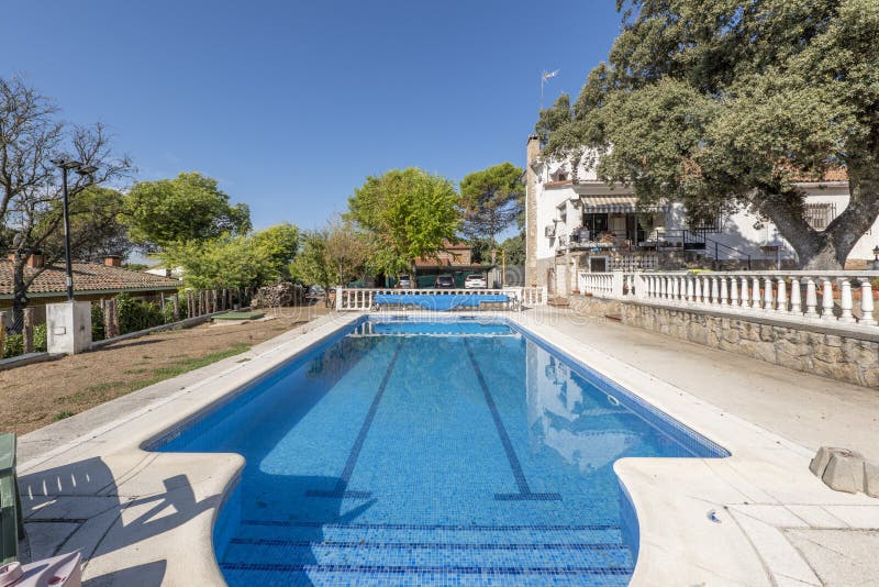 Swimming Pool of a Villa with Tile Stairs and White Balustrade Stock ...