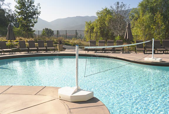Swimming Pool with Volleyball Net Stock Photo - Image of color, curved ...
