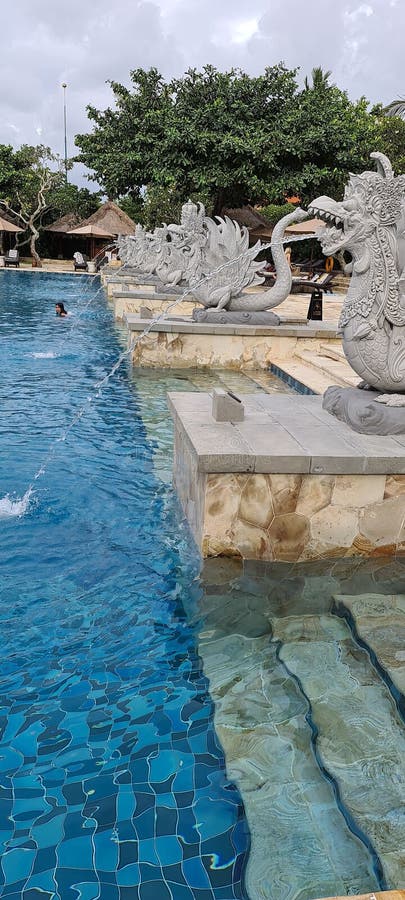 Swimming Pool with Water from Dragon Editorial Photo - Image of ...