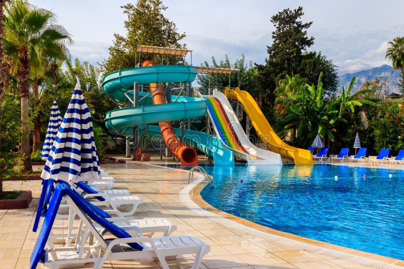 Swimming Pool with Water Slide at Tropic Summer Resort Stock Image ...