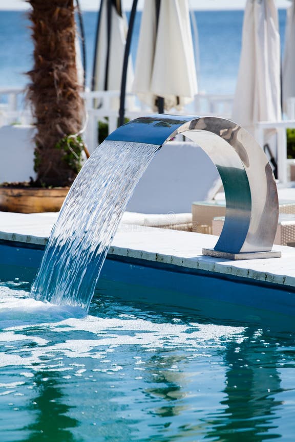 Swimming Pool Waterfall Jet Stock Photo - Image of palm, activity: 34296838