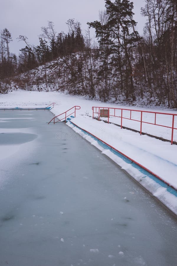 Swimming pool in winter stock image. Image of snowing - 268509101