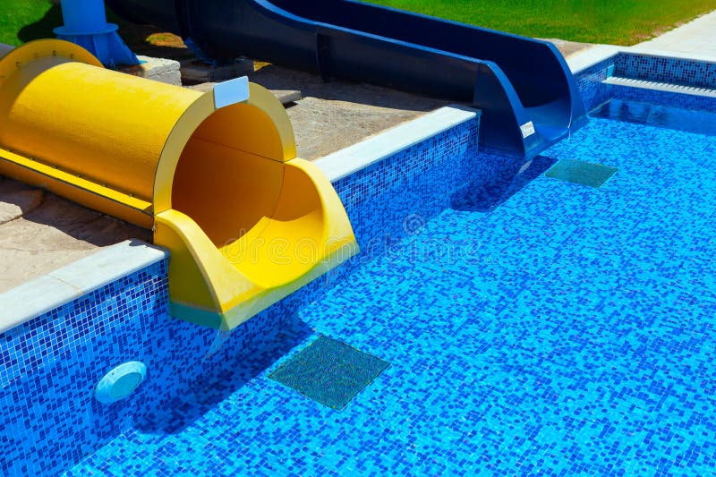 Swimming Pool with Yellow Slide Stock Photo - Image of tourism, clean ...