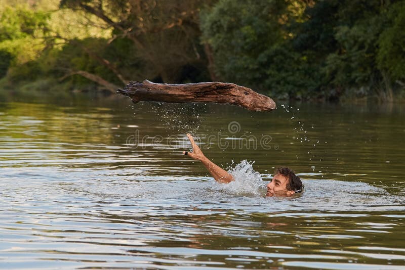 Swimming in River Throwing Log Stock Photo - Image of lake, outdoorsman ...