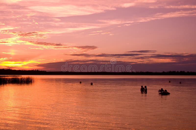 Swimming at Sunset stock image. Image of outdoors, sunset - 7670737