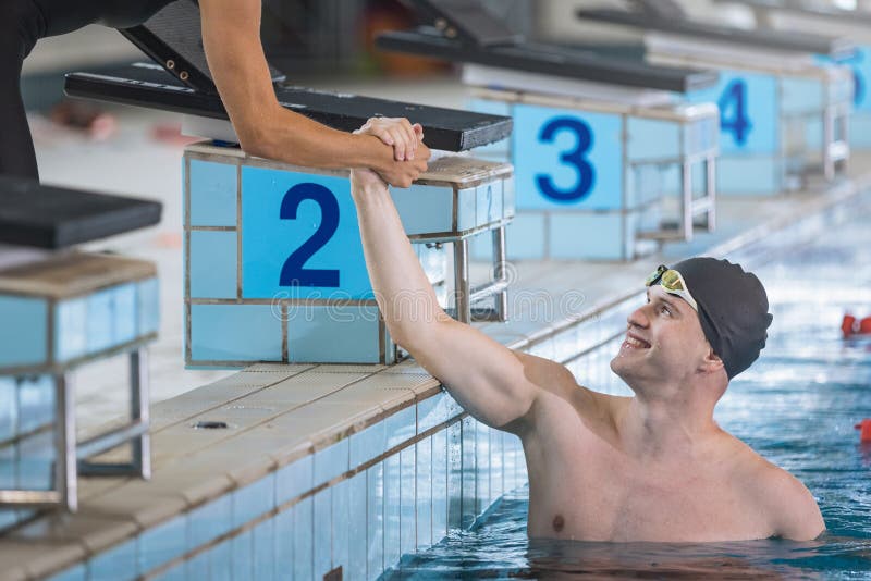 Swimming Teammates Giving High Five Stock Image - Image of pool ...