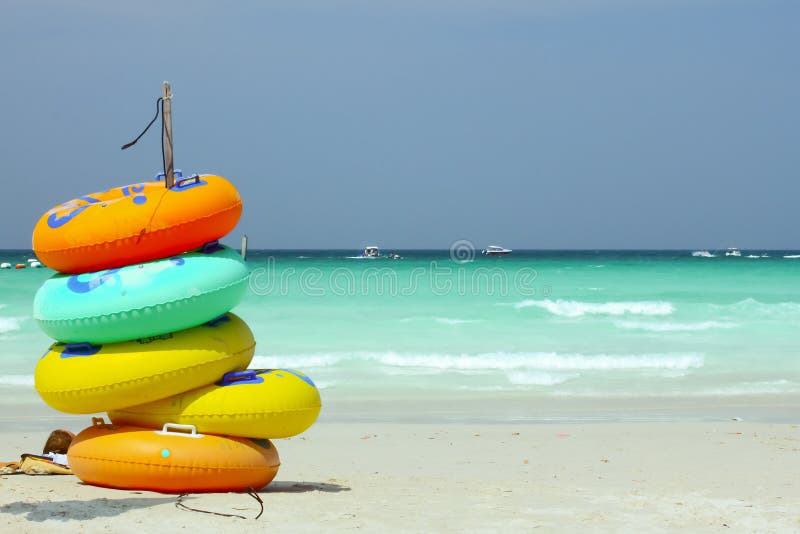 Stack of Swimming Tubes on the Beach Stock Image - Image of leisure ...