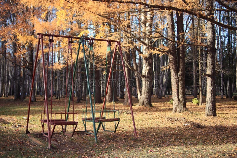 Swing Set in Autumn stock photo. Image of bark, season - 1598698