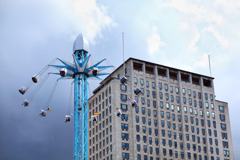 Swing Carousel with Building in the Background Editorial Photography ...
