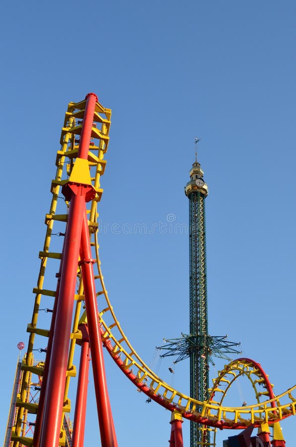 Swing Carousel and Roller Coaster Ride at Amusement Park Stock Photo ...