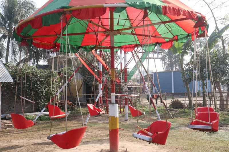 Swing Chair Kids Ride on Park Stock Photo - Image of carousel, orange ...