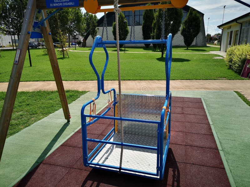 Swing for the Disabled Inserted in the Amusement Park Stock Photo ...