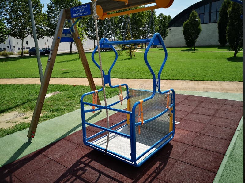 Swing for the Disabled Inserted in the Amusement Park Stock Photo ...