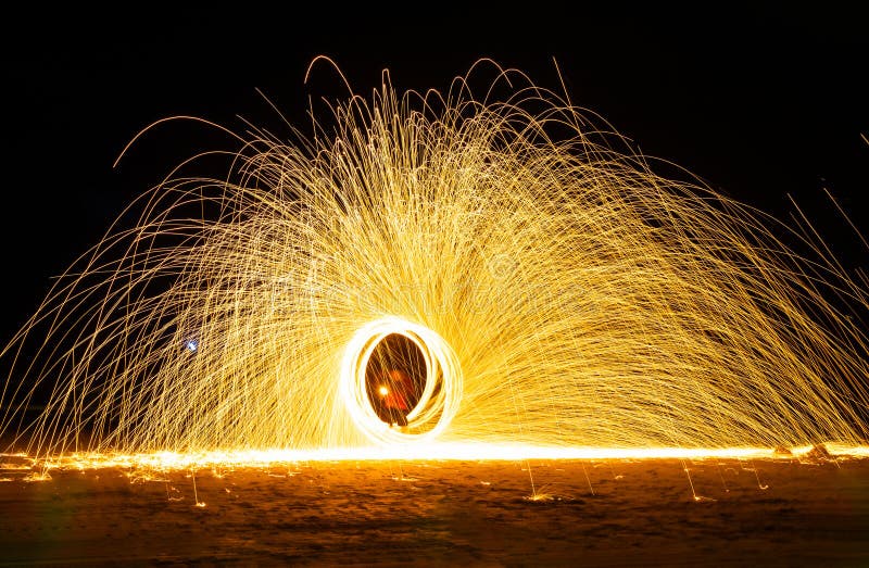 Swing Fire Dancing Show, Long Exposure on the Floor at the Night Time ...