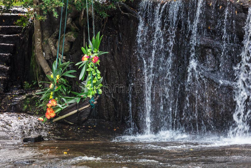 Swing with Flowers To a Waterfall Stock Image - Image of stone, motion ...