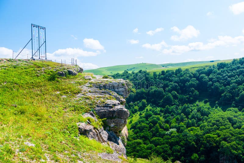 Swing Over the Alikonovsky Gorge on Mount Ukazatel. Stock Photo - Image ...