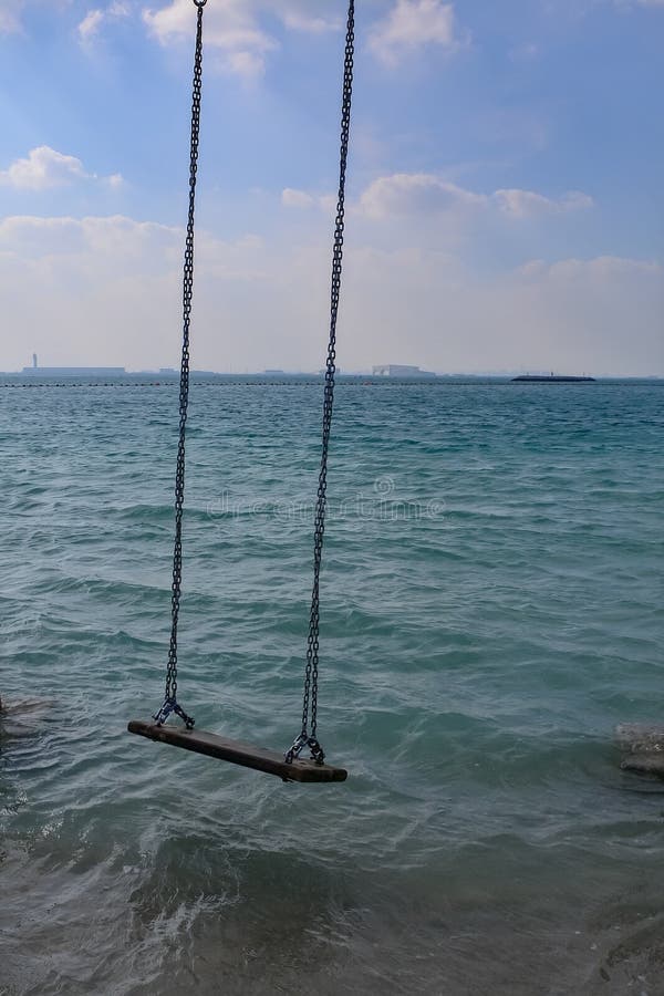 Swing Over the Water at High Tide Stock Image - Image of holiday ...