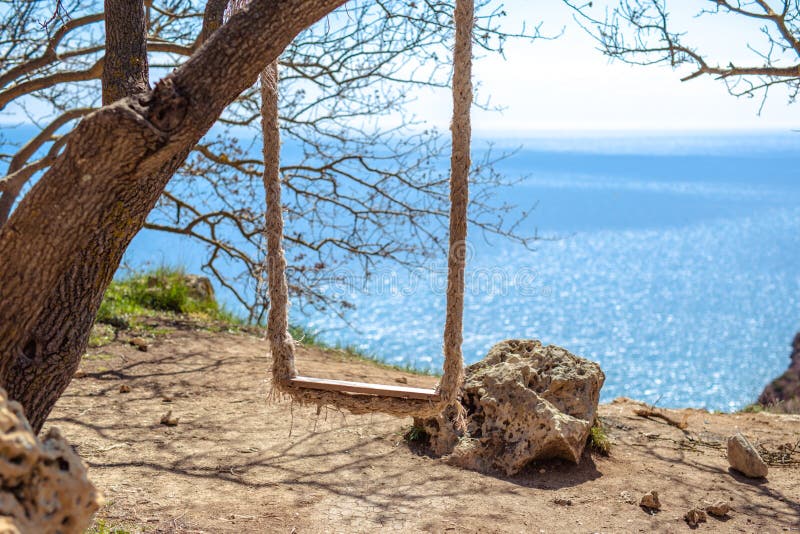 Swing Overlooking the Sea Over the Cliff. Stock Image - Image of ...