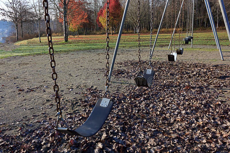 Swing set in late fall stock image. Image of park, lake - 106751181