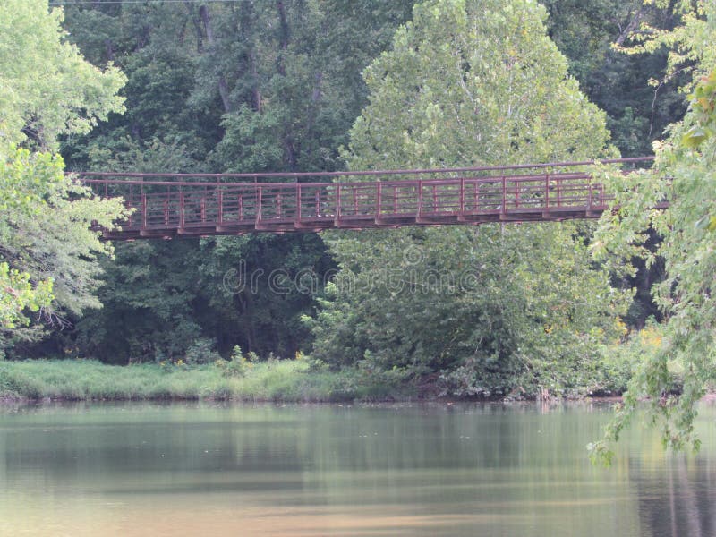 Swinging bridge stock image. Image of swinging, water - 101905583