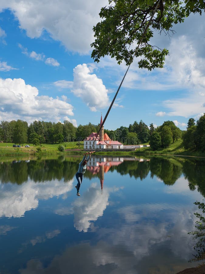Swinging on the Rope Above the Water. Stock Photo - Image of nature ...