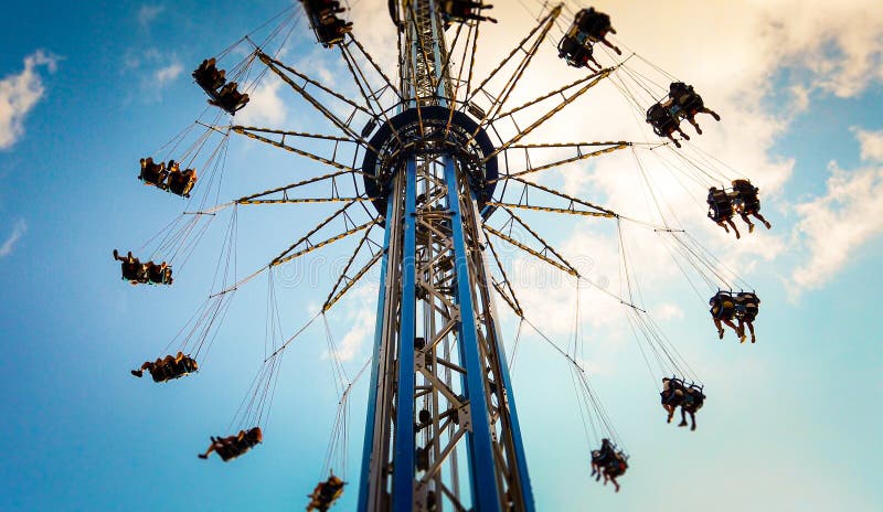 Swings in amusement park stock photo. Image of happy - 156534808