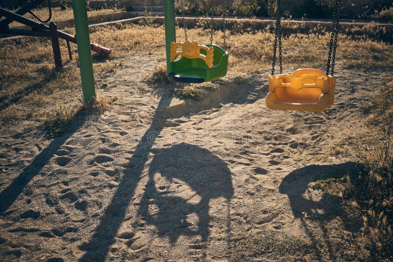 Swings at Empty Playground in the Evening Stock Image - Image of green ...