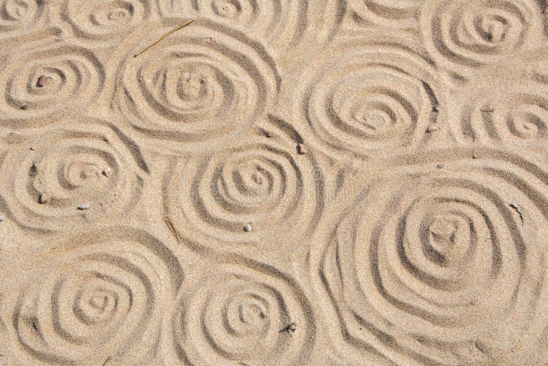Swirl Pattern on the Sand. Hand Drawn Swirls on the Sandy Beach Stock ...