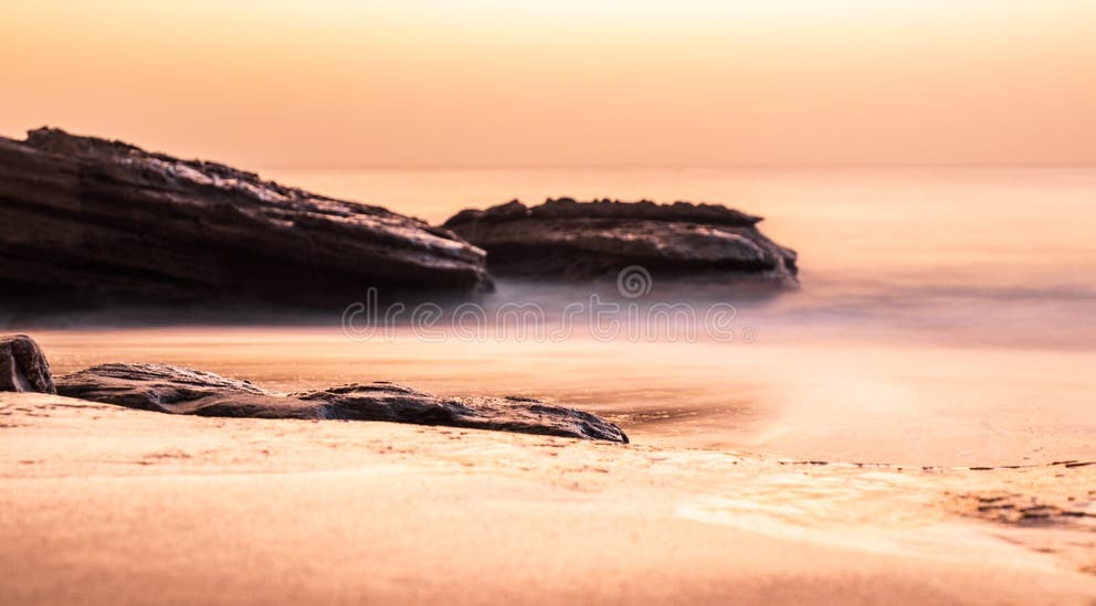 Swirl Patterns of Waves between Rocks at Sunset Time Stock Image ...