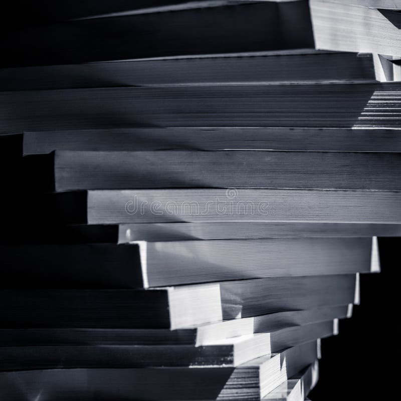 Swirl of Stacked Books in Black and White Blue Toned Stock Image ...