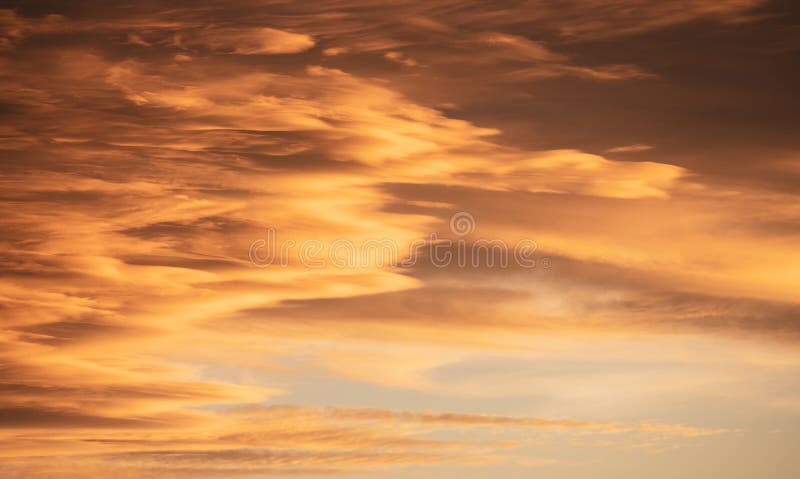 Swirling Peach Clouds Cover Sky at Sunset Stock Photo - Image of orange ...