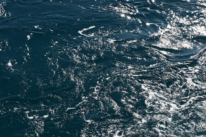 Swirling Sea Water with Bright Spots of Sun Glare Stock Photo - Image ...