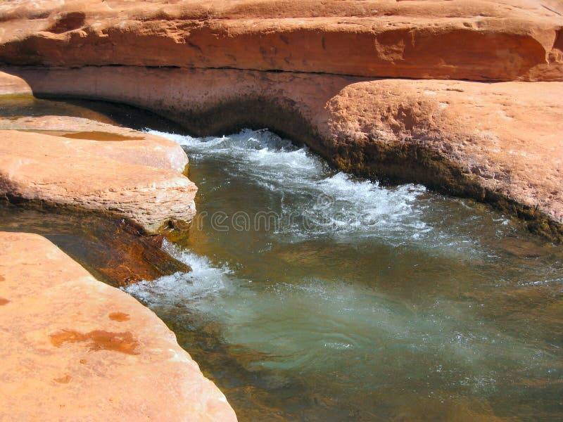 Swirling Water in the Red Rocks Stock Image - Image of water, swirling ...