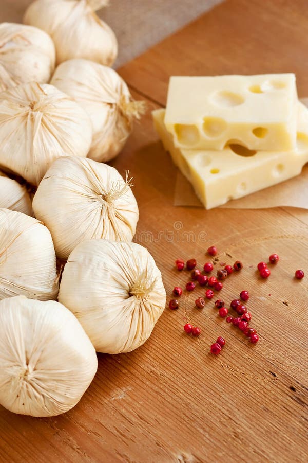 Swiss cheese and garlic stock photo. Image of cheese - 16062508