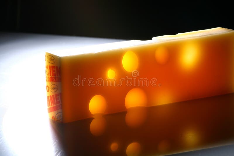 Swiss Cheese with Holes on Table Stock Photo - Image of gourmet ...