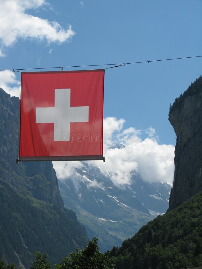 Swiss flag in the Alps stock photo. Image of valley, mountainside - 6853004