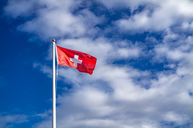 Swiss Flag on Flagpole. Waving in the Wind Stock Image - Image of flag ...