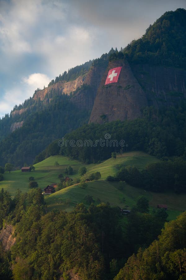 Swiss Flag Hanging on a Steep Rock Face Stock Image - Image of vale ...